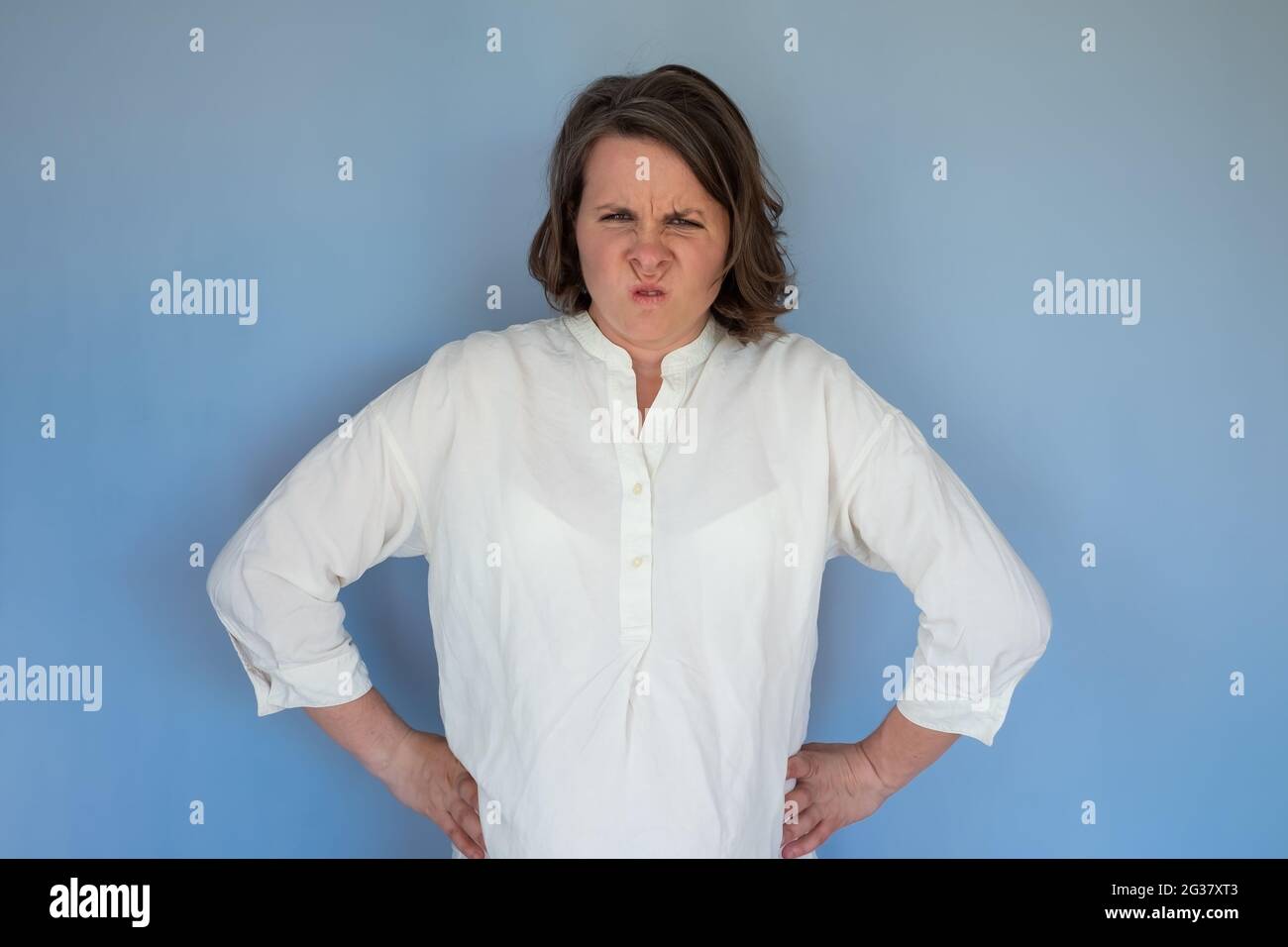 Annoyed angry caucasian woman frowning her nose Stock Photo - Alamy