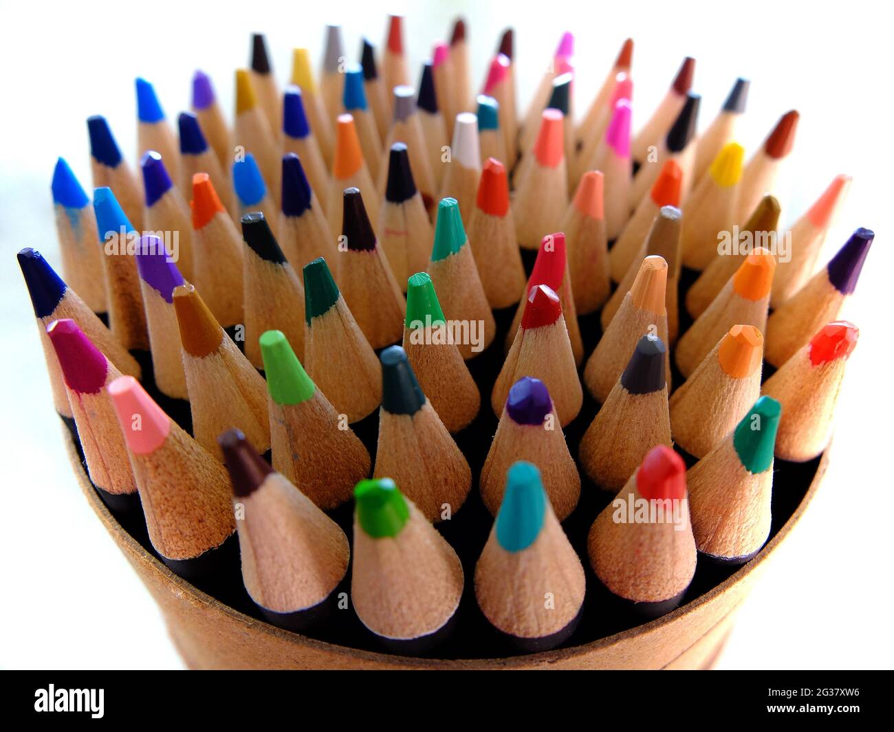 Large pile amount of colored pencils in a tube holder for art and ...