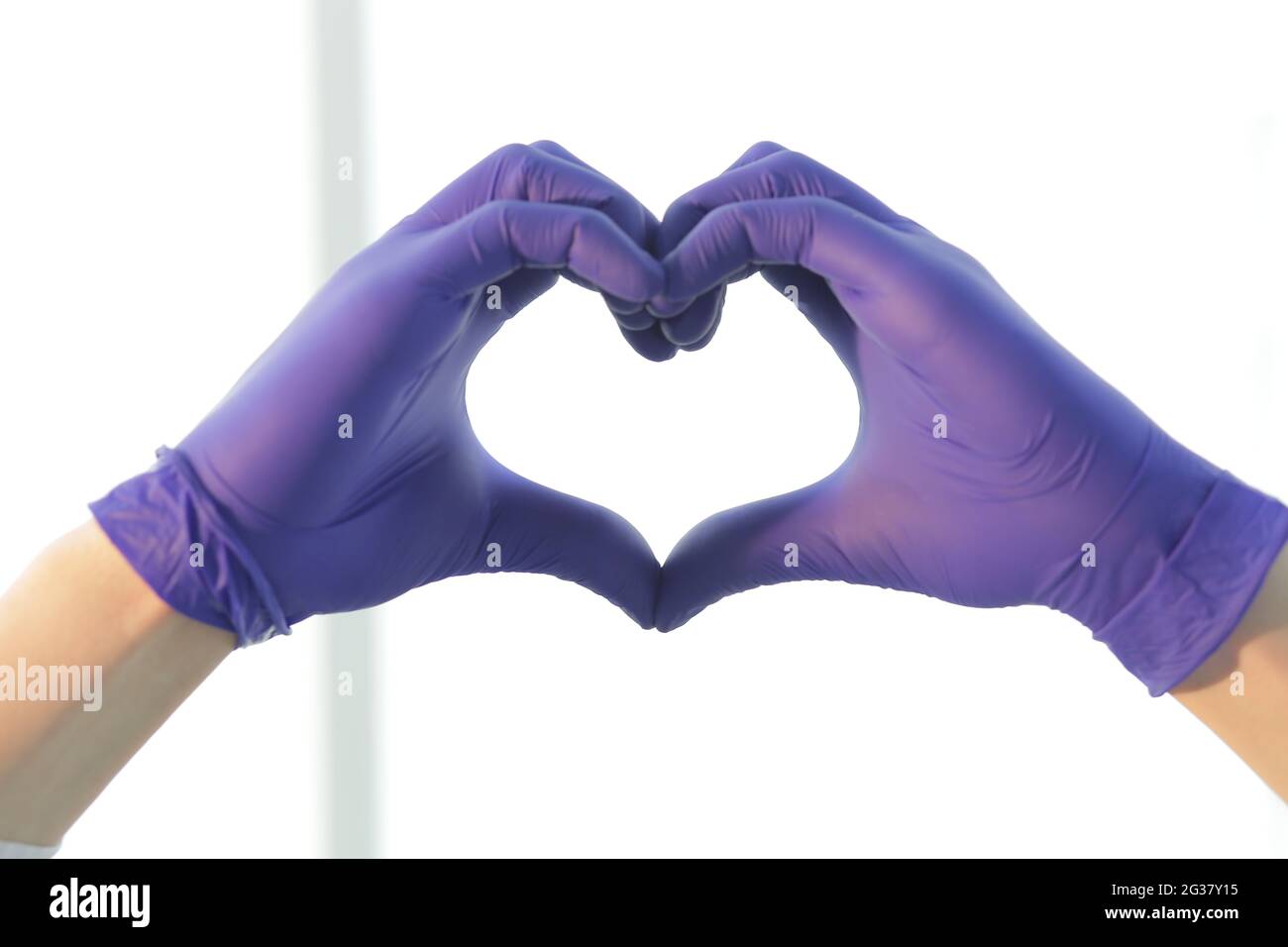 Doctor hands making heart sign hi-res stock photography and images - Alamy