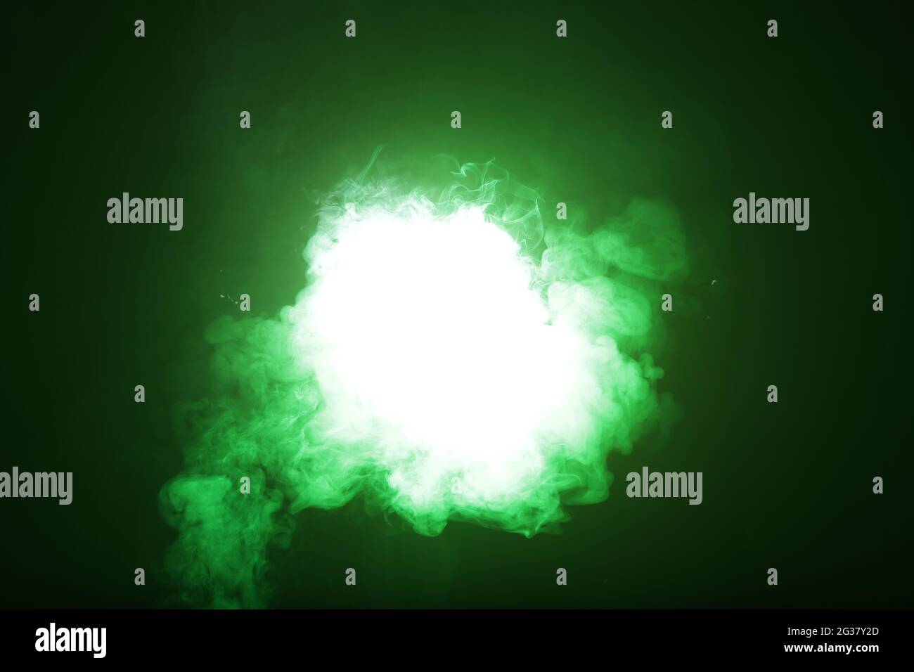 Smoke in green light on black background Stock Photo - Alamy