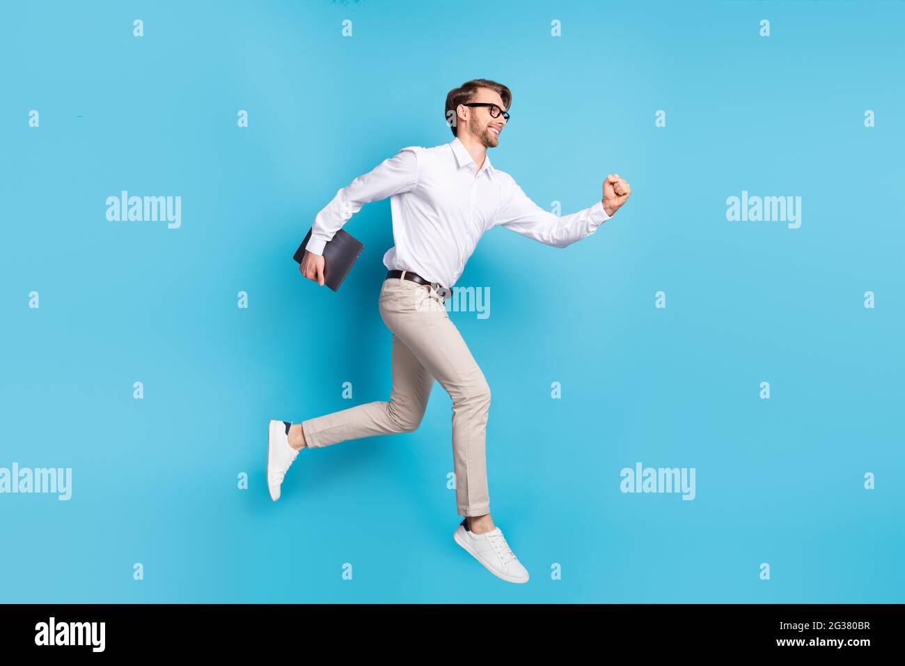 Full length body size view of attractive cheerful man jumping running ...