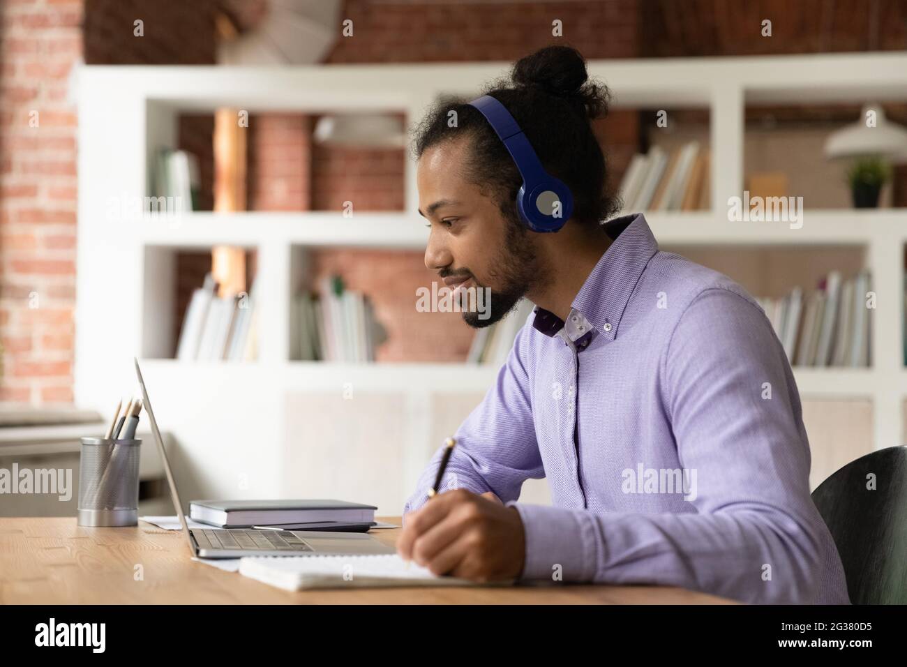 Interested young african american man listening educational lecture ...