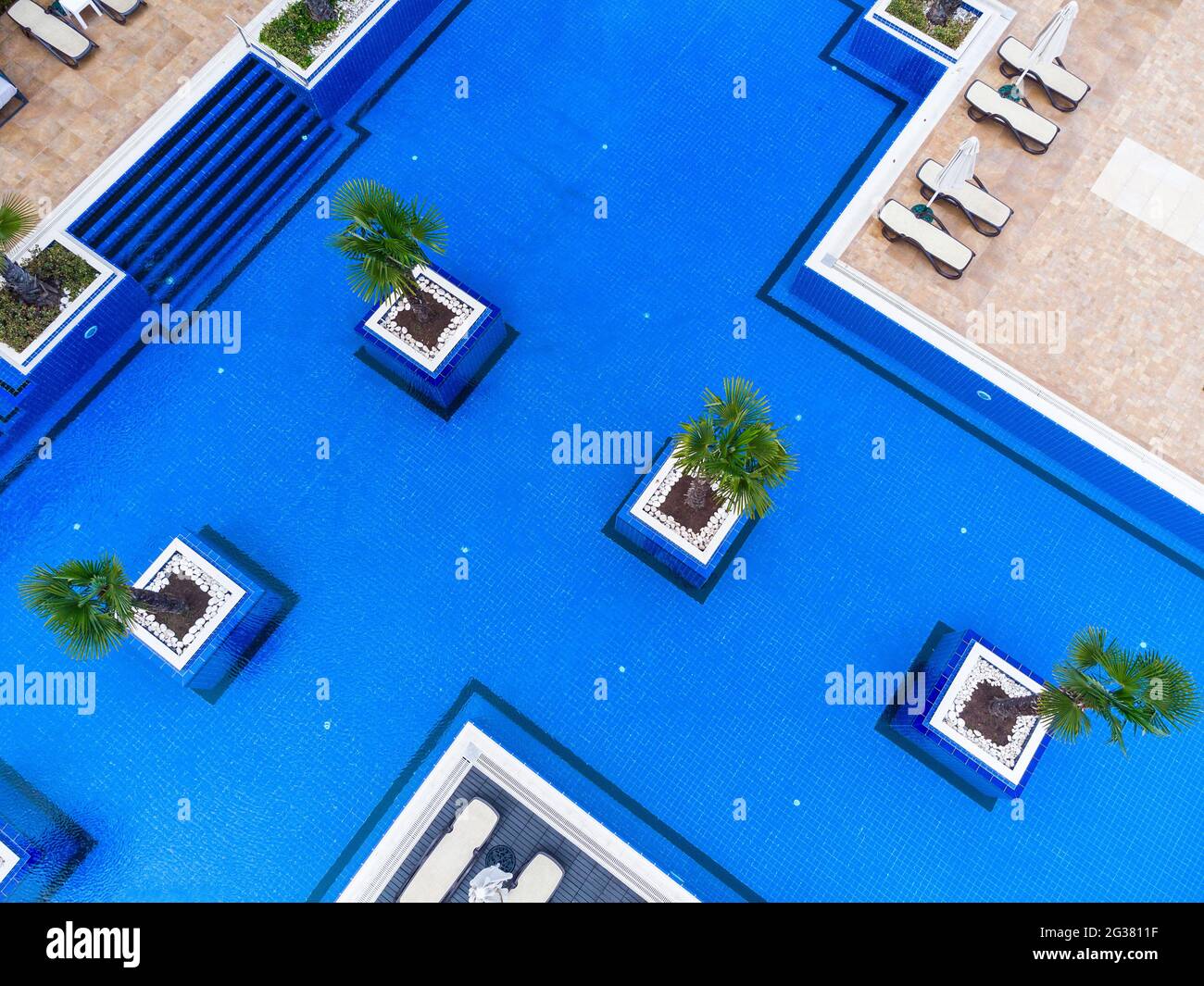Aerial view of luxury outdoor swimming pool and deck-chairs Stock Photo ...