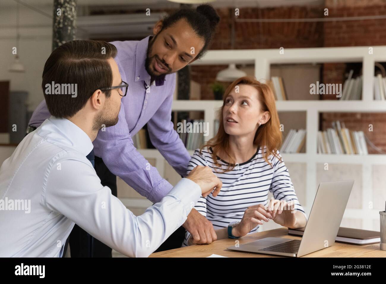 Happy multiracial employees brainstorming together in modern office ...