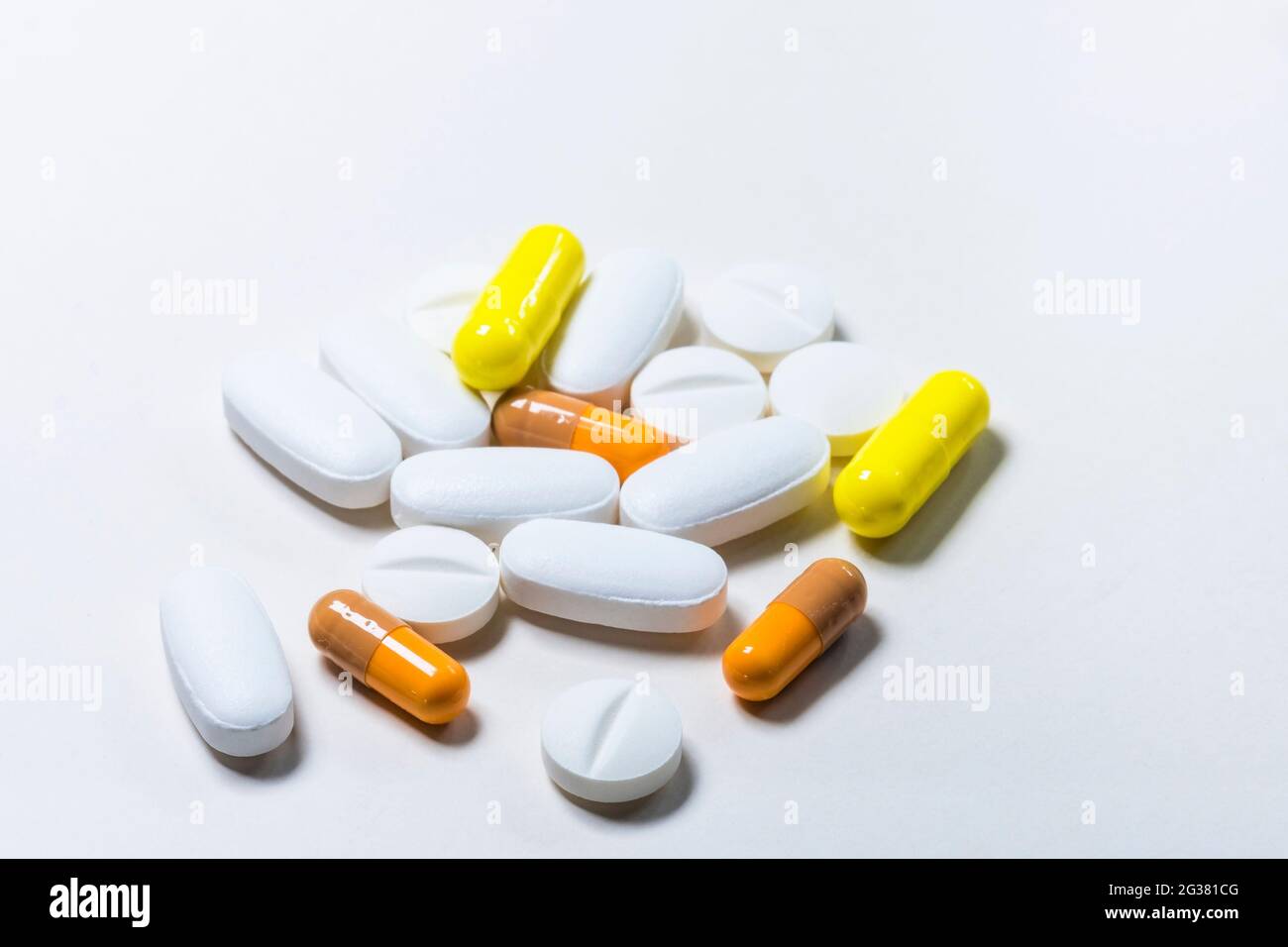 Colorful medicine tablets on a white background Stock Photo - Alamy