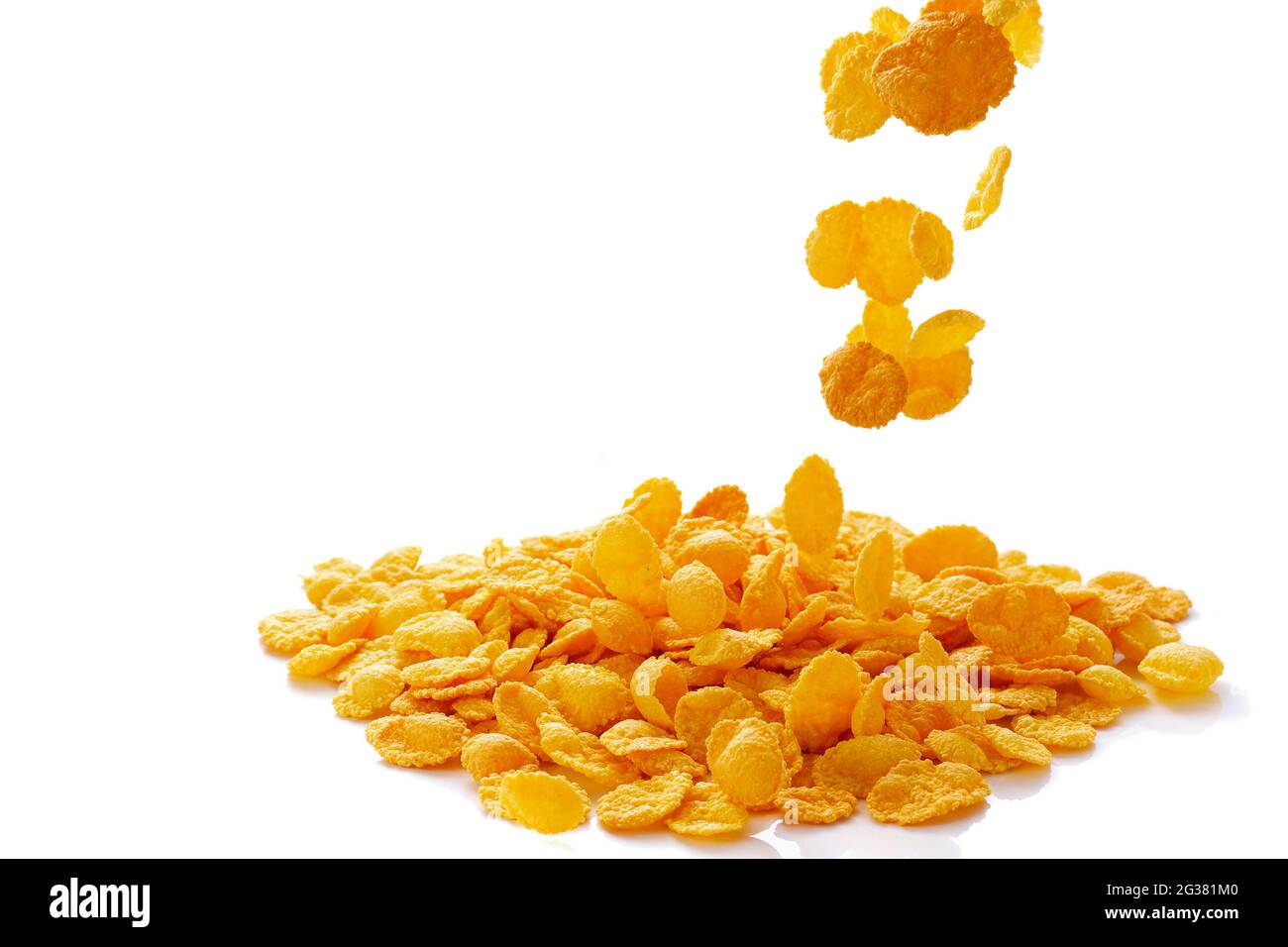 closeup of falling corn flakes isolated on white background Stock Photo ...