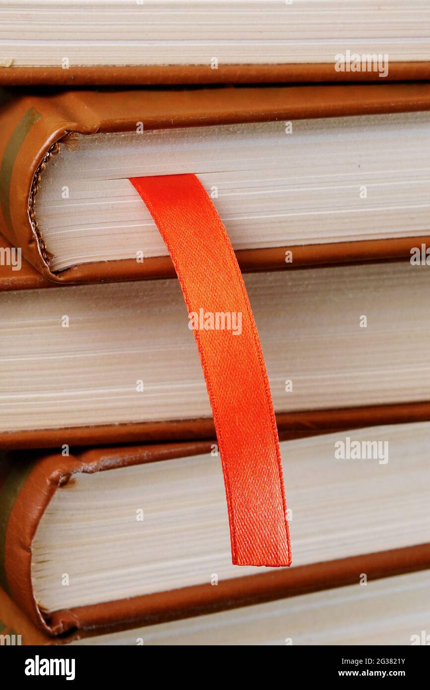 pile of books with bookmark in one Stock Photo - Alamy