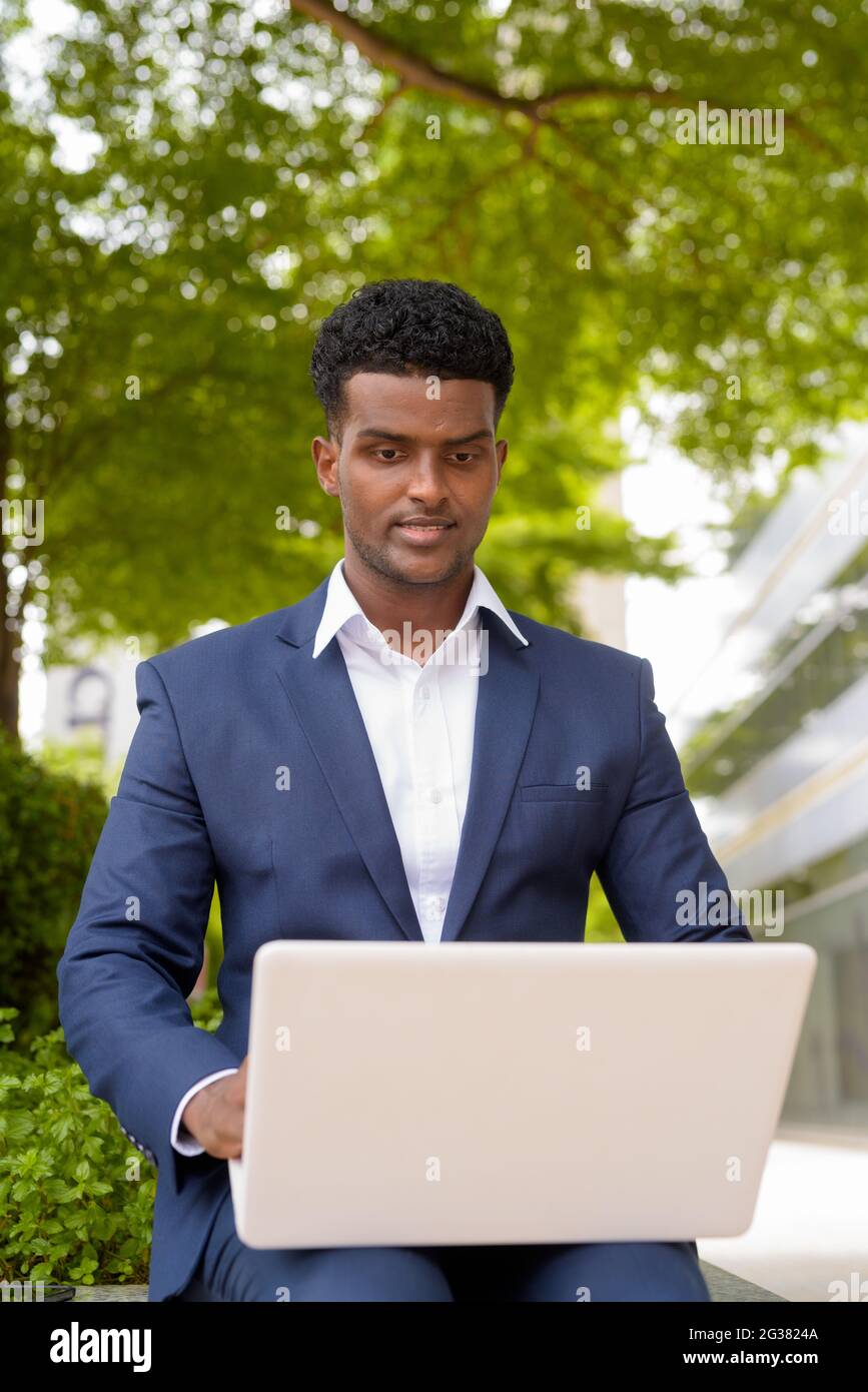 African male laptop outside hi-res stock photography and images - Alamy