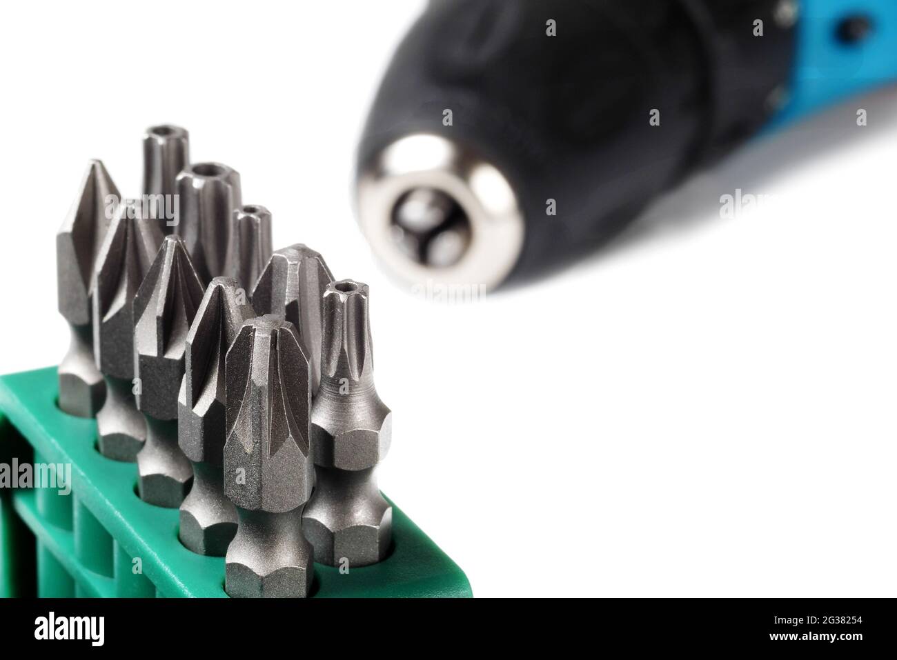 closeup of bit set with screwdriver chuck in background, isolated on ...