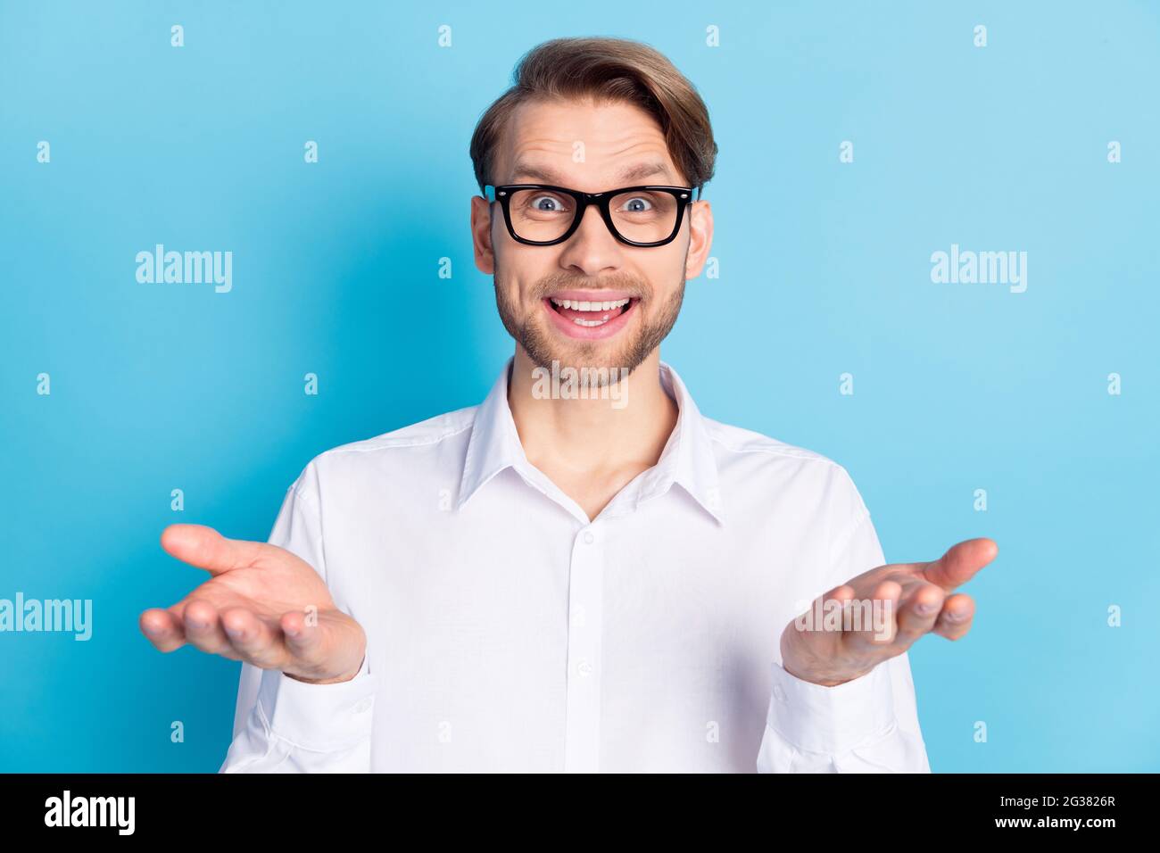 Portrait of attractive glad intellectual cheerful man talking to you ...