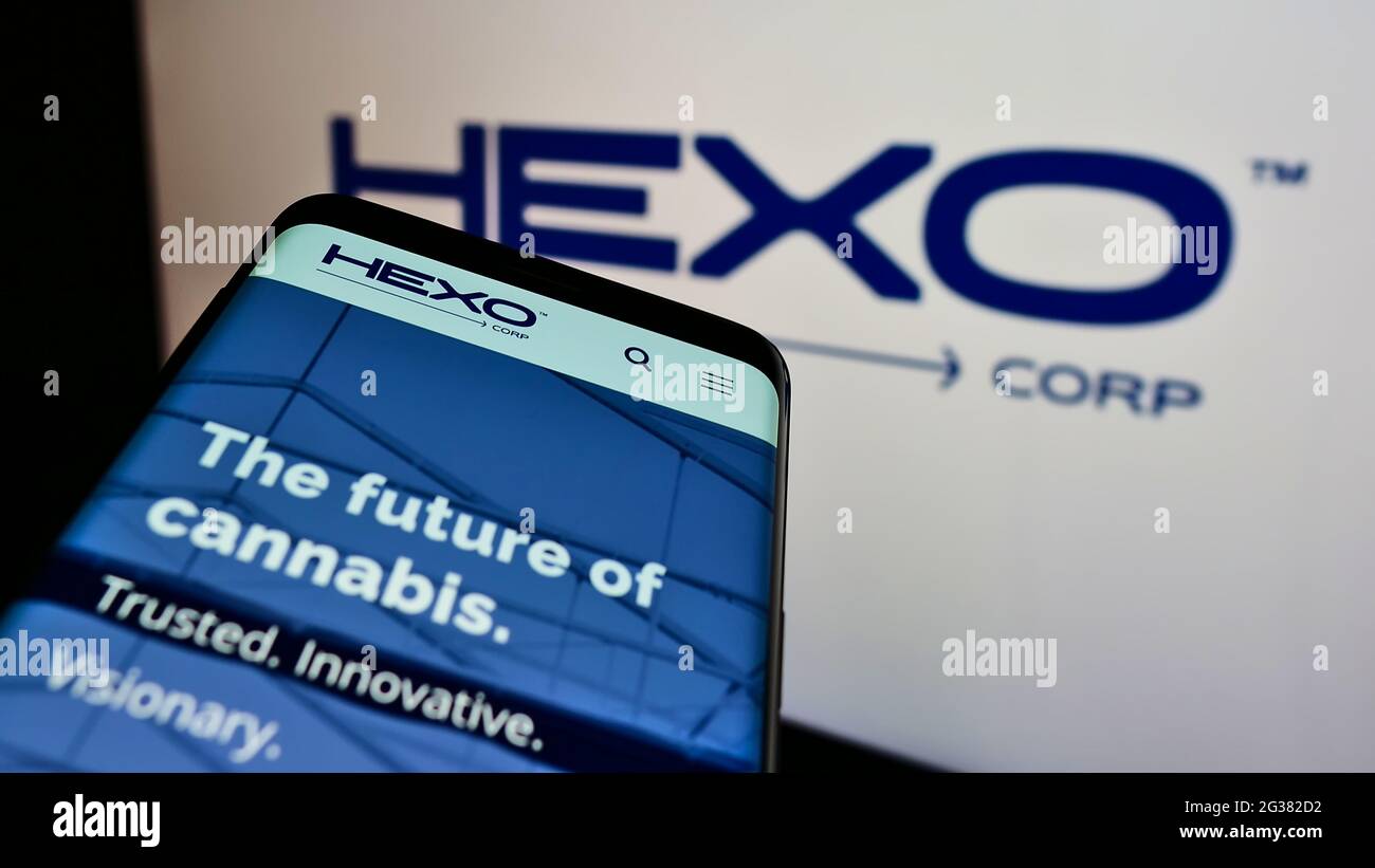 Smartphone with business website of Canadian cannabis company HEXO Corp ...
