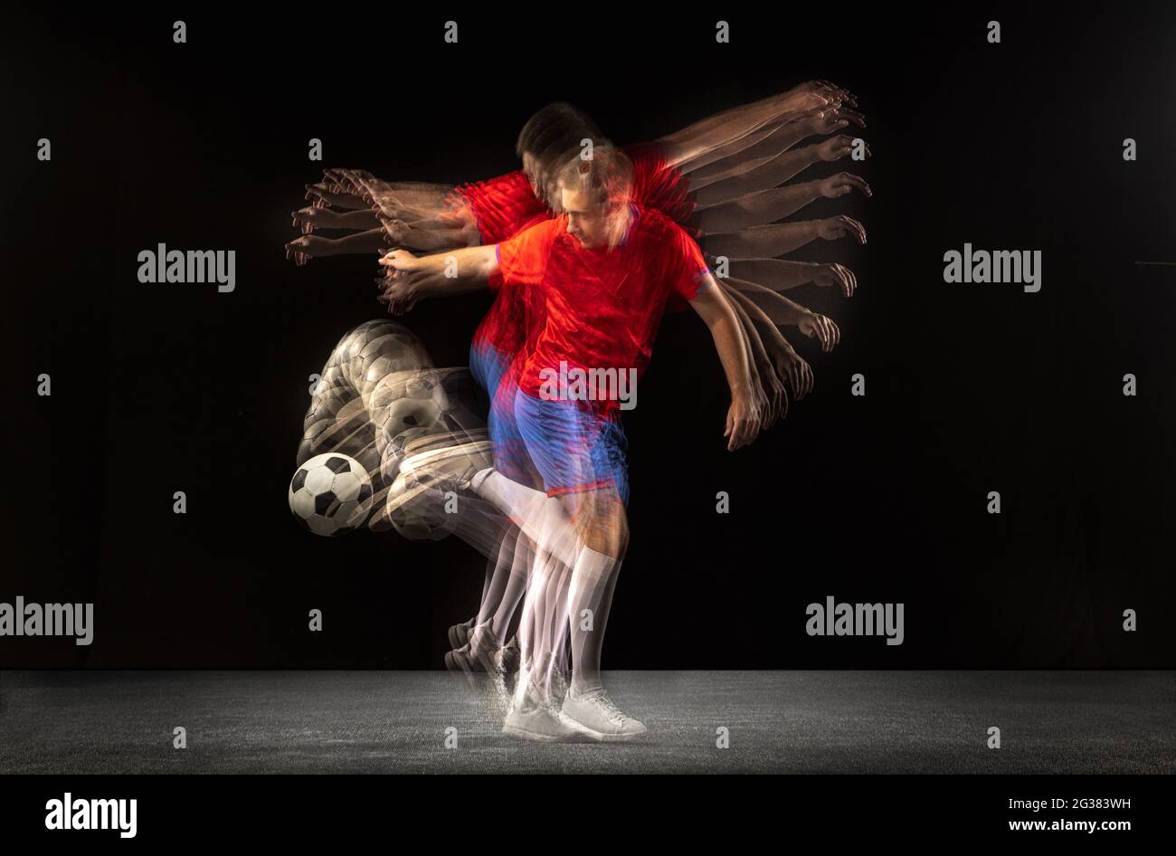 Non stop moving. Young caucasian football soccer player playing in ...