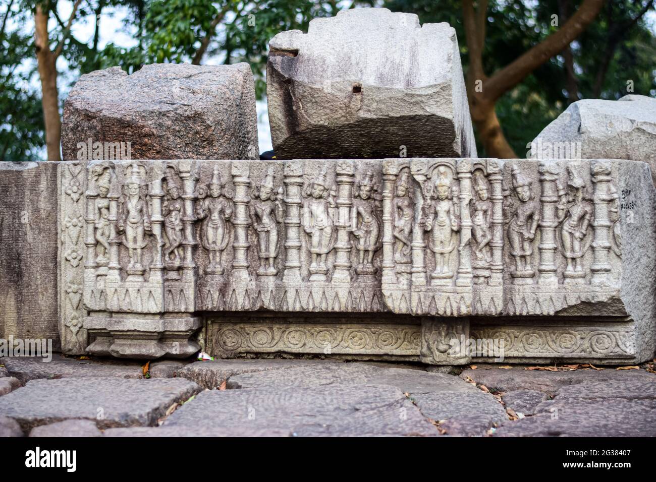 Carved people on ancient stone Stock Photo - Alamy