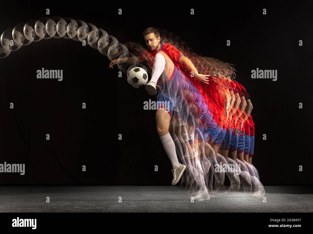 Non stop moving. Young caucasian football soccer player playing in ...