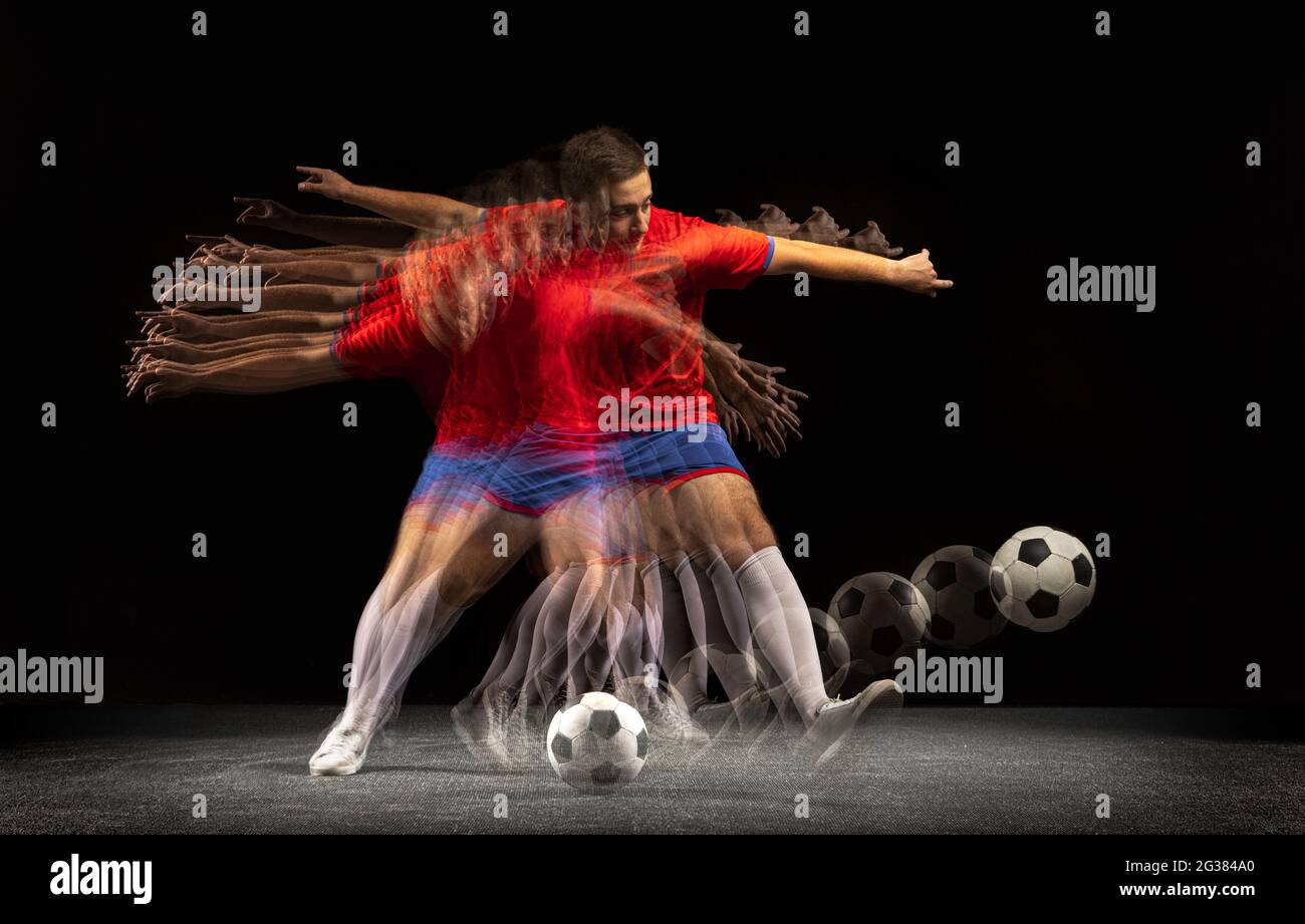 Non stop moving. Young caucasian football soccer player playing in ...