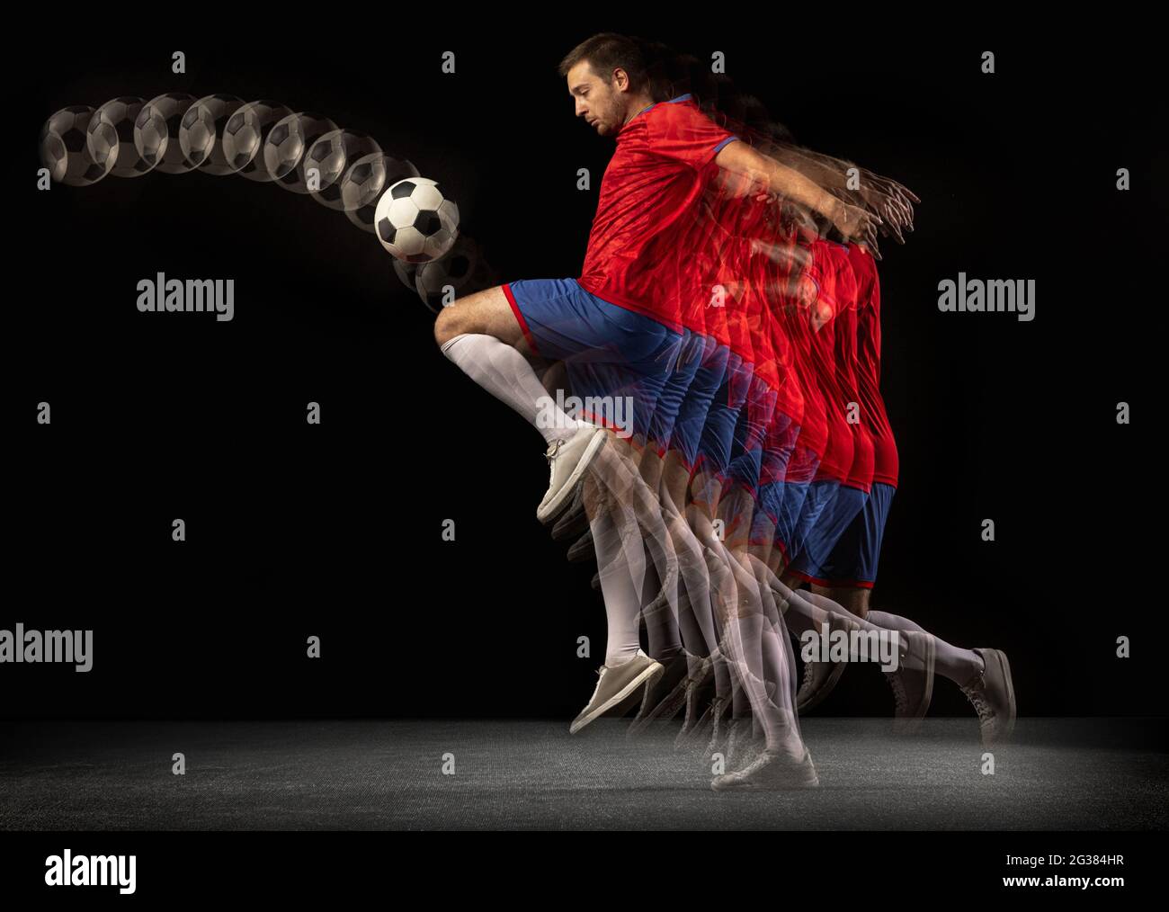 Non stop moving. Young caucasian football soccer player playing in ...