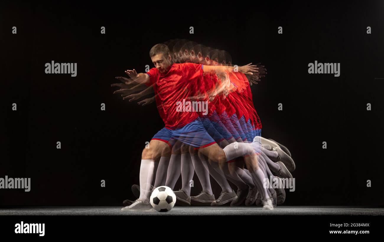 Non stop moving. Young caucasian football soccer player playing in ...