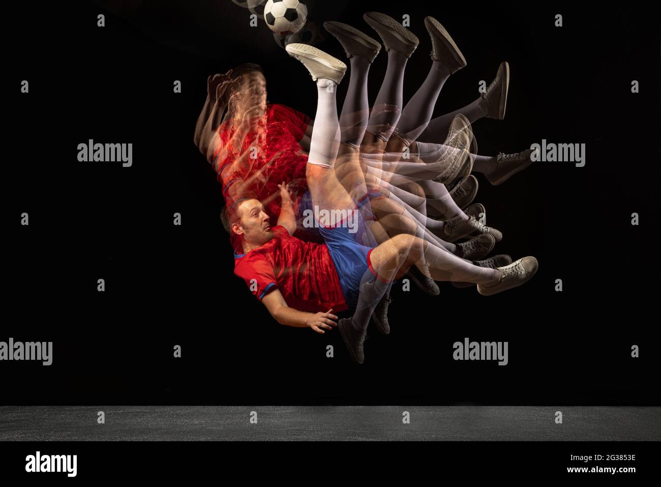 Non stop moving. Young caucasian football soccer player playing in ...