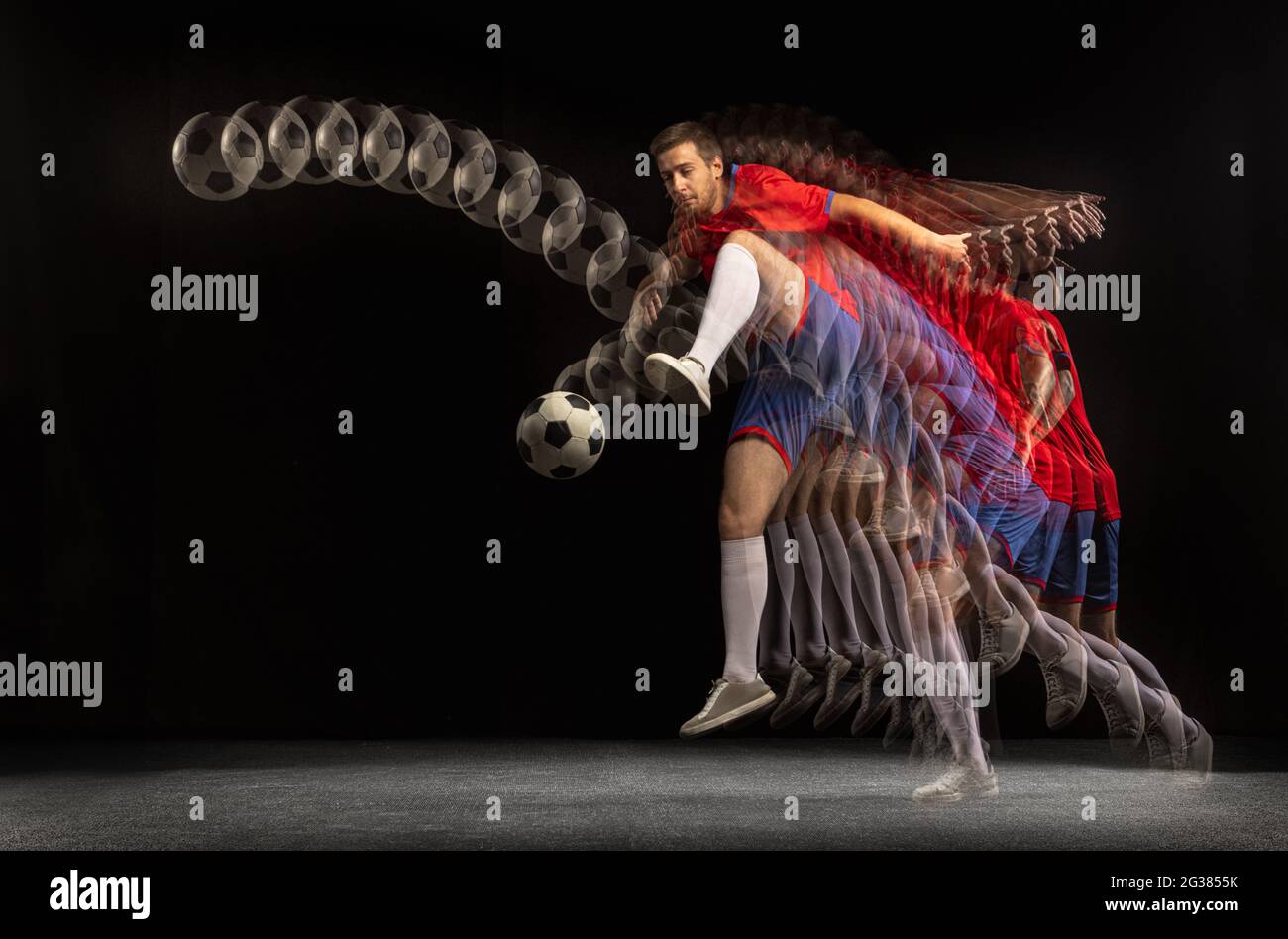 Non stop moving. Young caucasian football soccer player playing in ...
