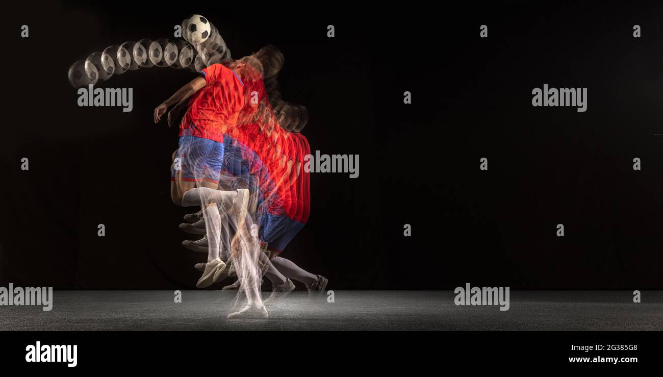 Non stop moving. Young caucasian football soccer player playing in ...