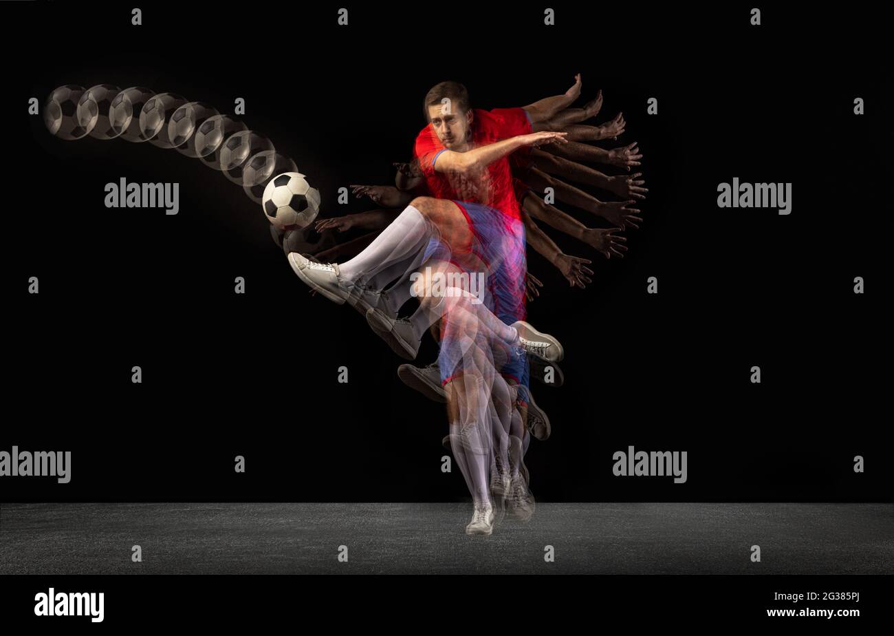 Non stop moving. Young caucasian football soccer player playing in ...