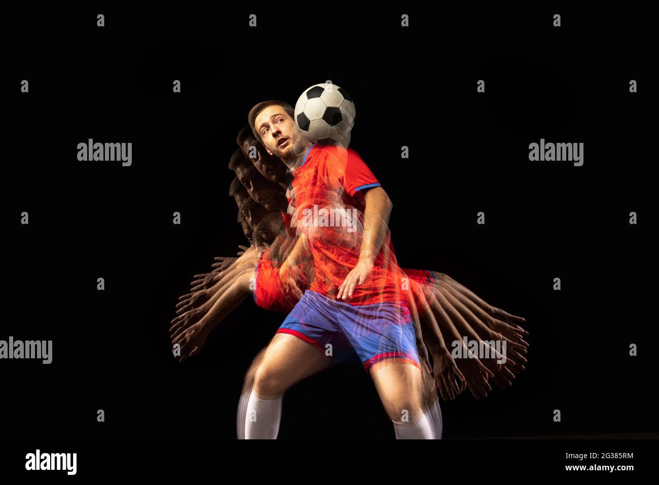 Non stop moving. Young caucasian football soccer player playing in ...