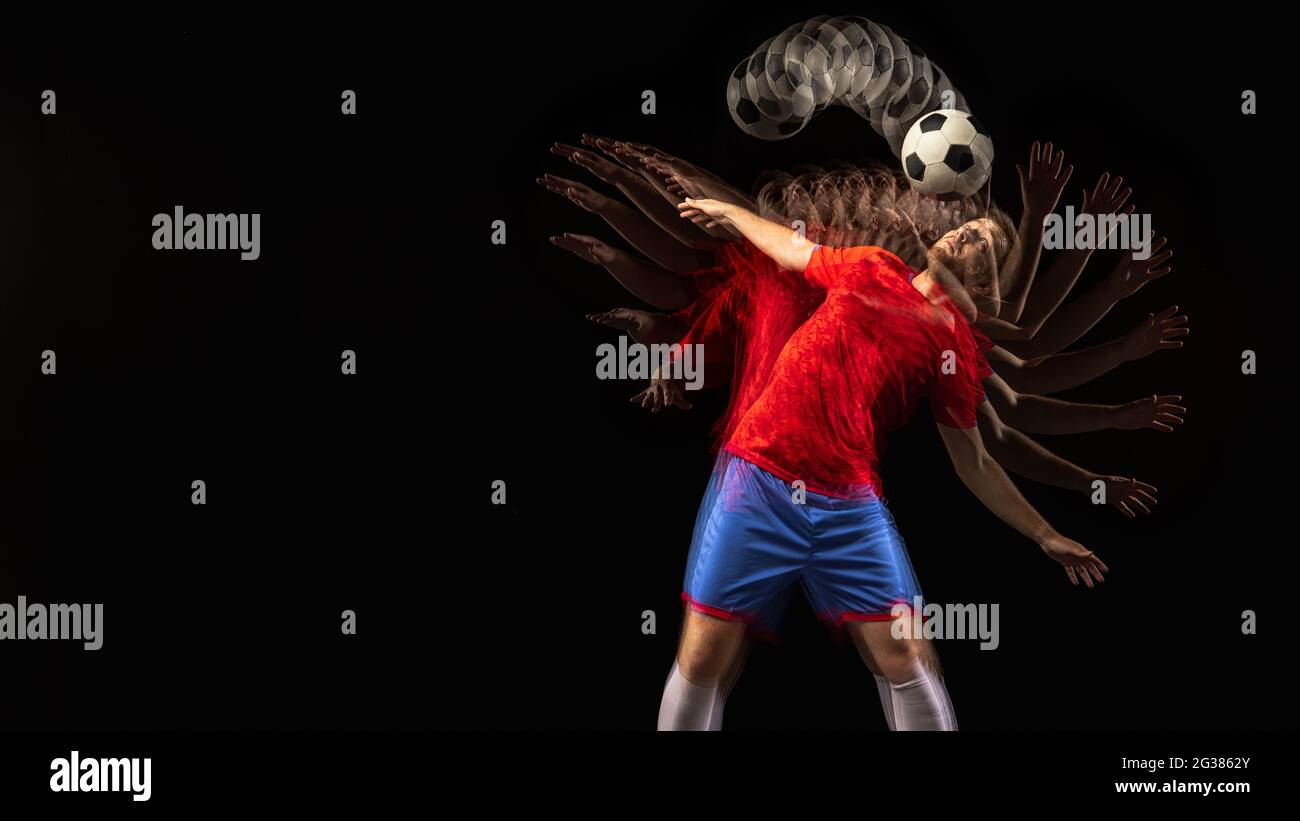 Non stop moving. Young caucasian football soccer player playing in ...