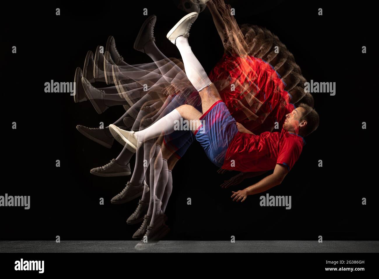 Non stop moving. Young caucasian football soccer player playing in ...