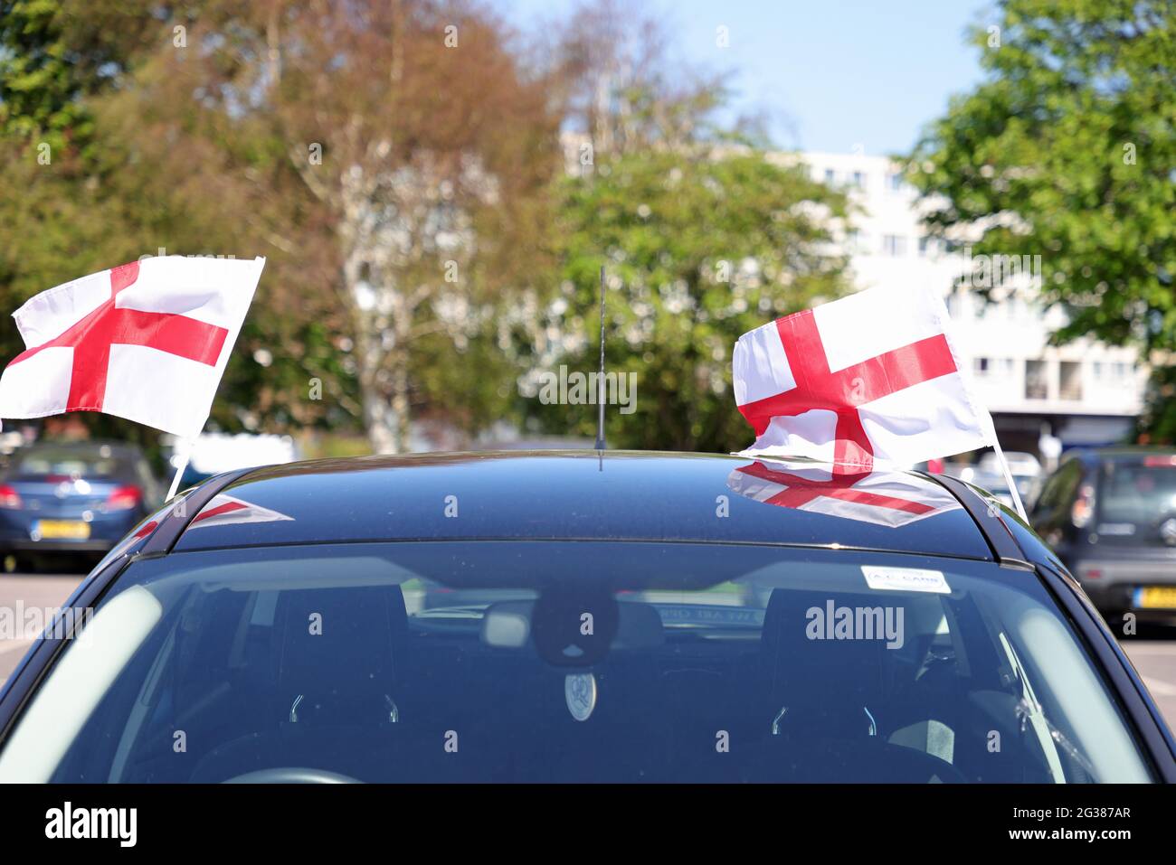 English football flags seen on the sides of a car Stock Photo - Alamy