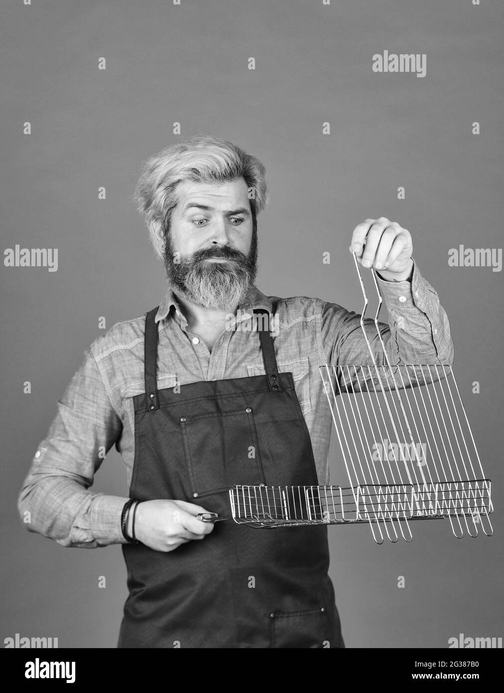 use cooking utensils and various products. mature chef use cooking ...