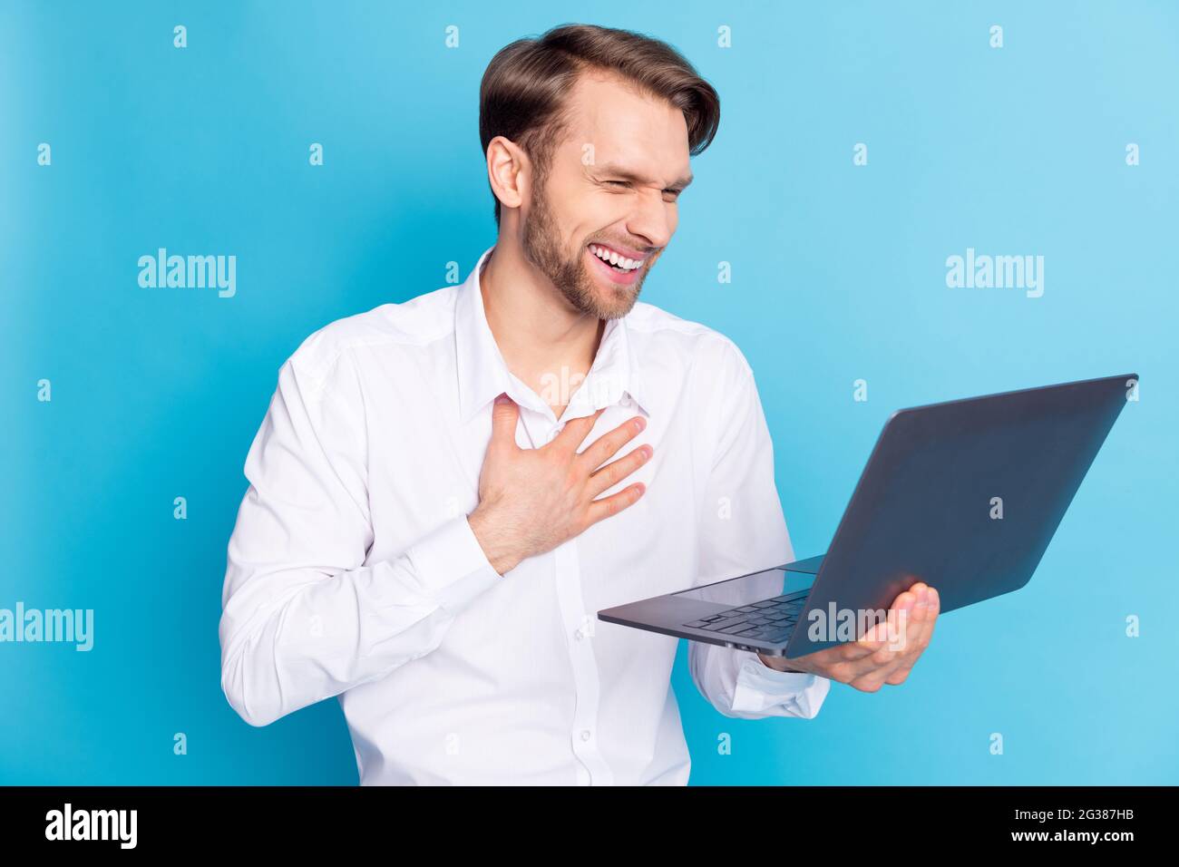 Photo of happy funny young man look computer laugh good joke comic ...