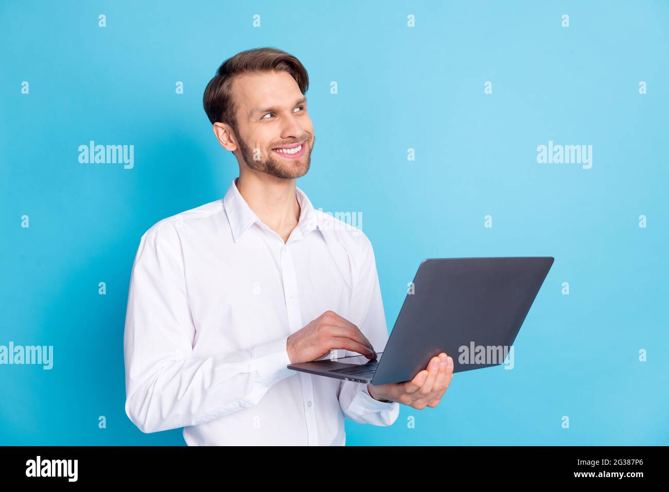 Photo of dreamy young man look empty space good mood imagine hold ...