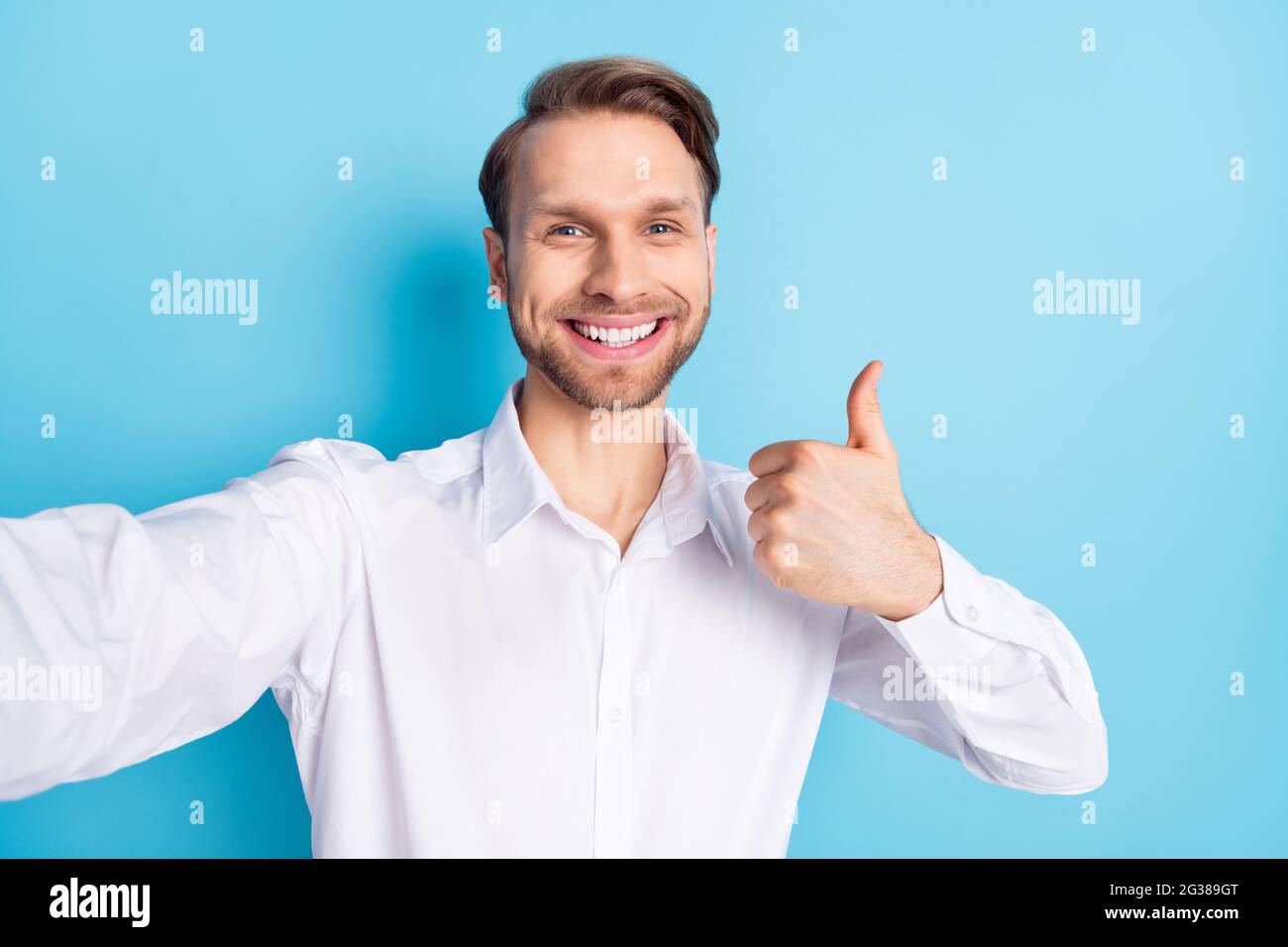 Photo of happy charming young man take selfie camera show thumb-up ...