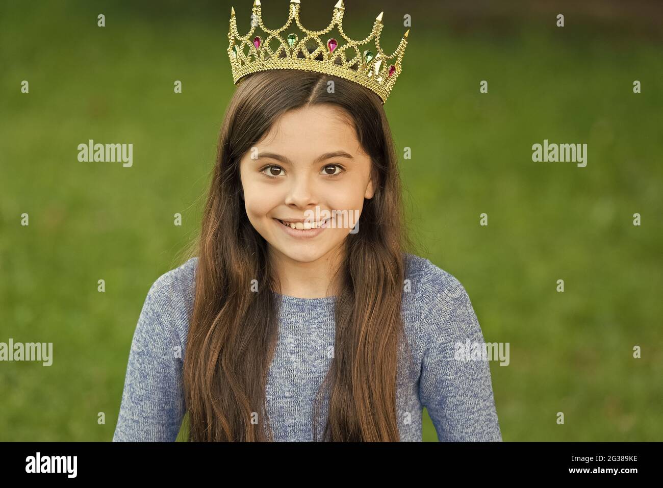 Cute girl golden crown outdoors green nature background, natural power ...