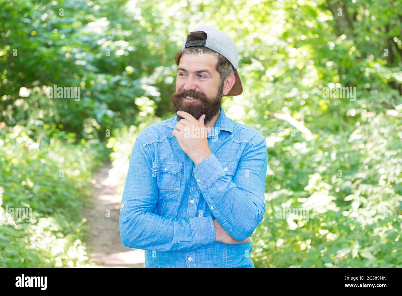 happy bearded man portrait. brutal mature hipster with beard in forest ...