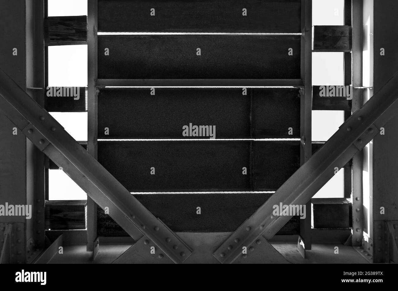 view of a structure of gray metal railway bridge for train, down to up ...