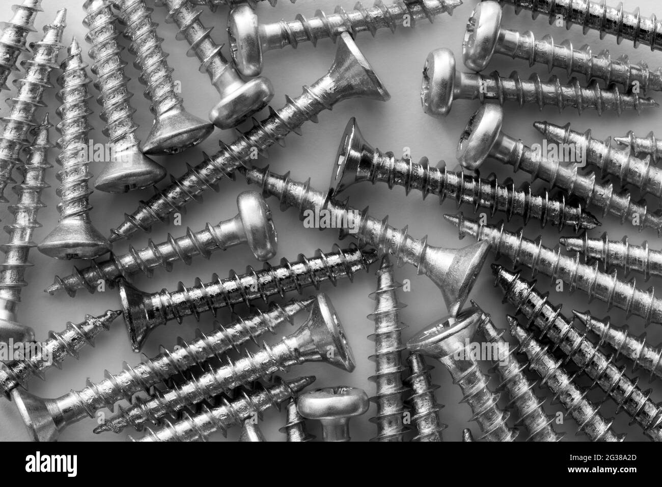 Metal screws over technical drawing close-up Stock Photo - Alamy