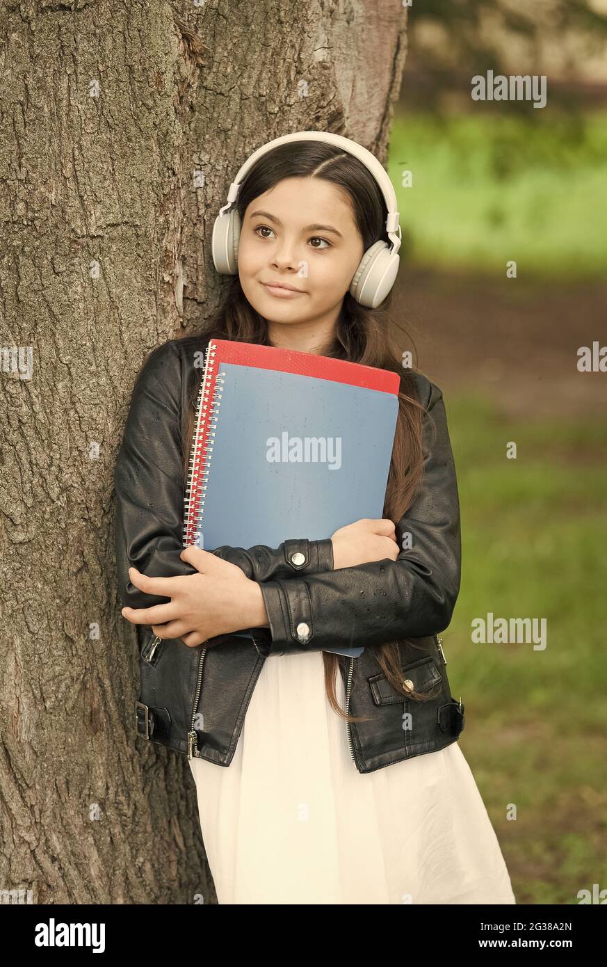 Girl listening audio carry textbooks relaxing park background, library ...