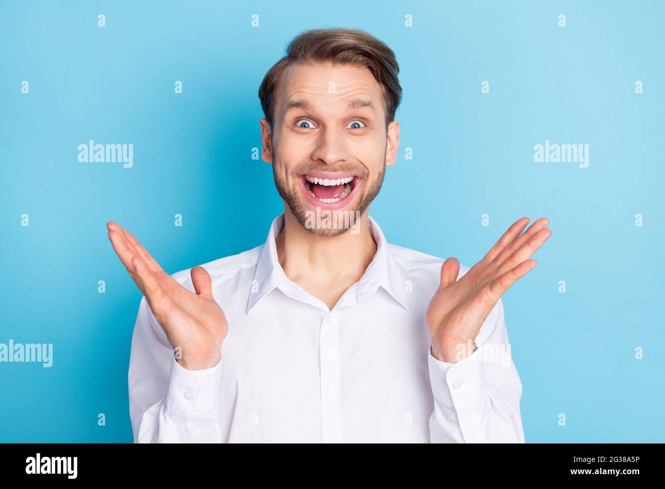 Photo of amazed happy excited young blonde man raise hands shock ...