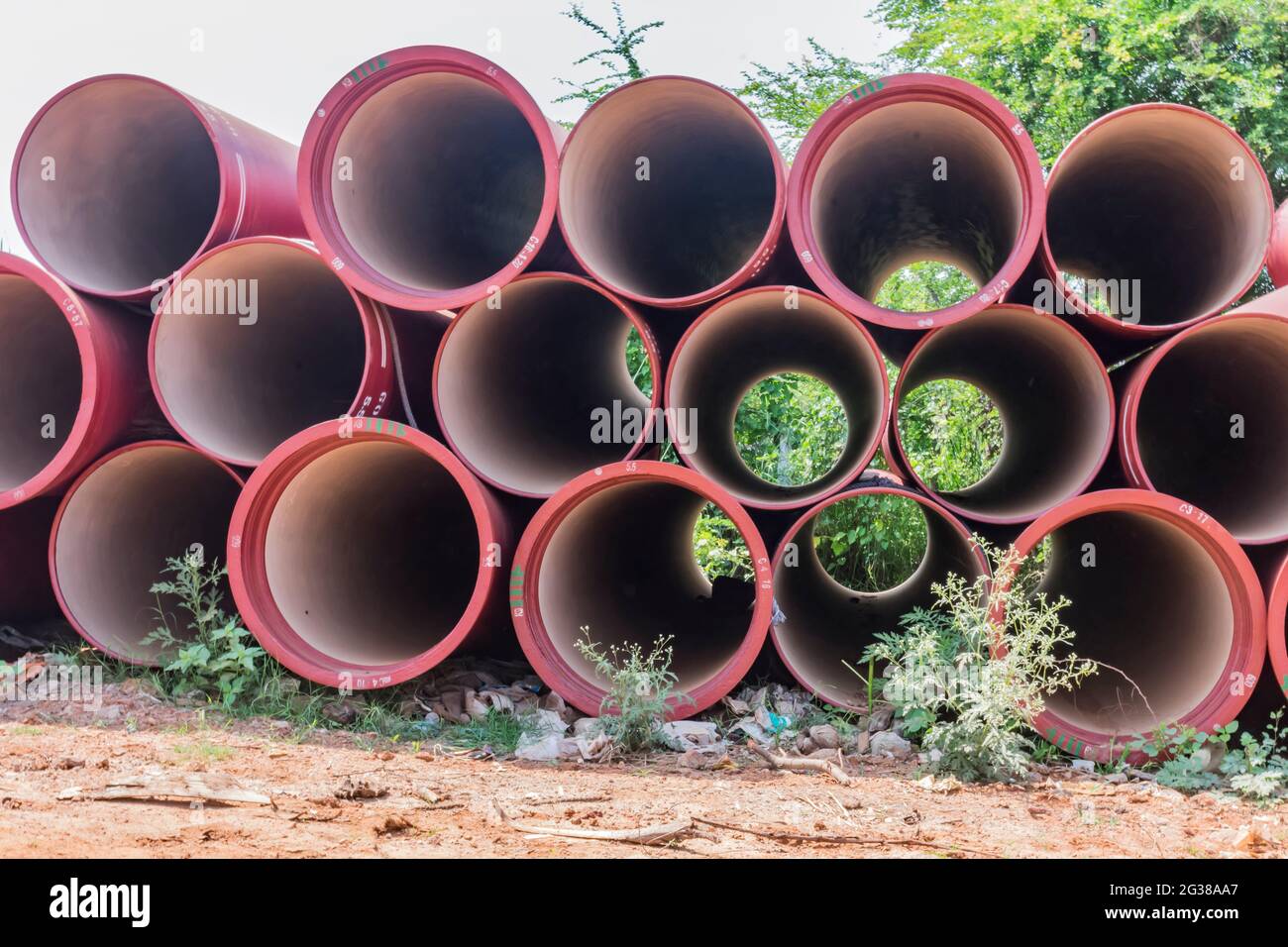 front circular view of ductile iron pipes stocked in open space godown ...