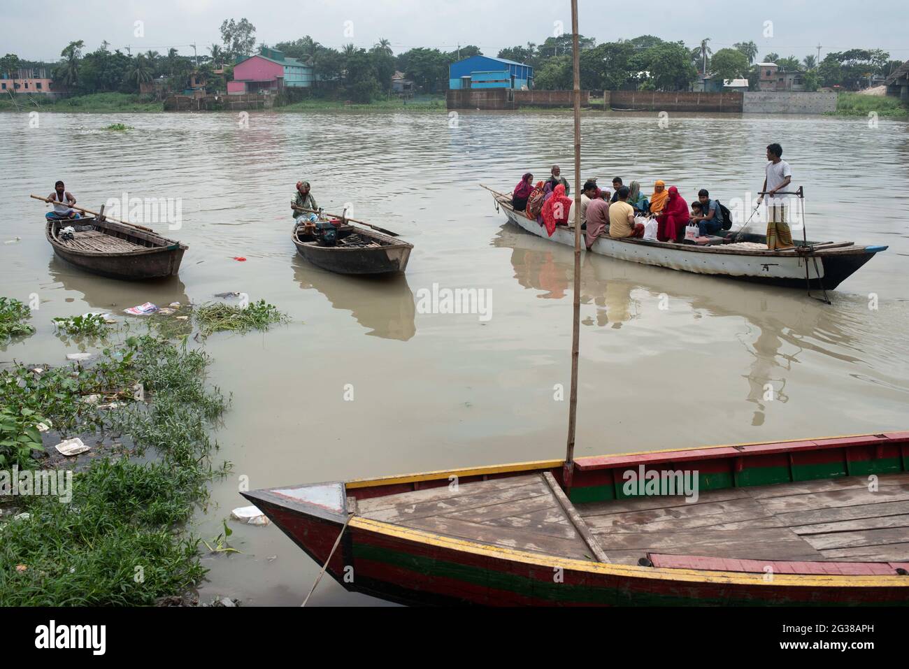 Dhaka, Dhaka, Bangladesh. 14th June, 2021. Passenger boats passes ...
