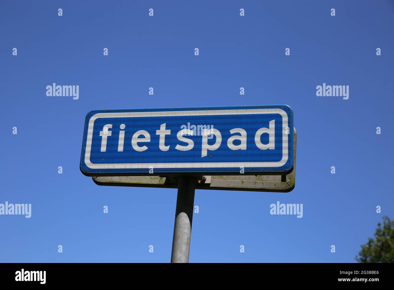 View on isolated dutch sign against blue sky with word fietspad ...