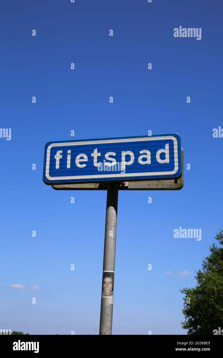 View on isolated dutch sign against blue sky with word fietspad ...