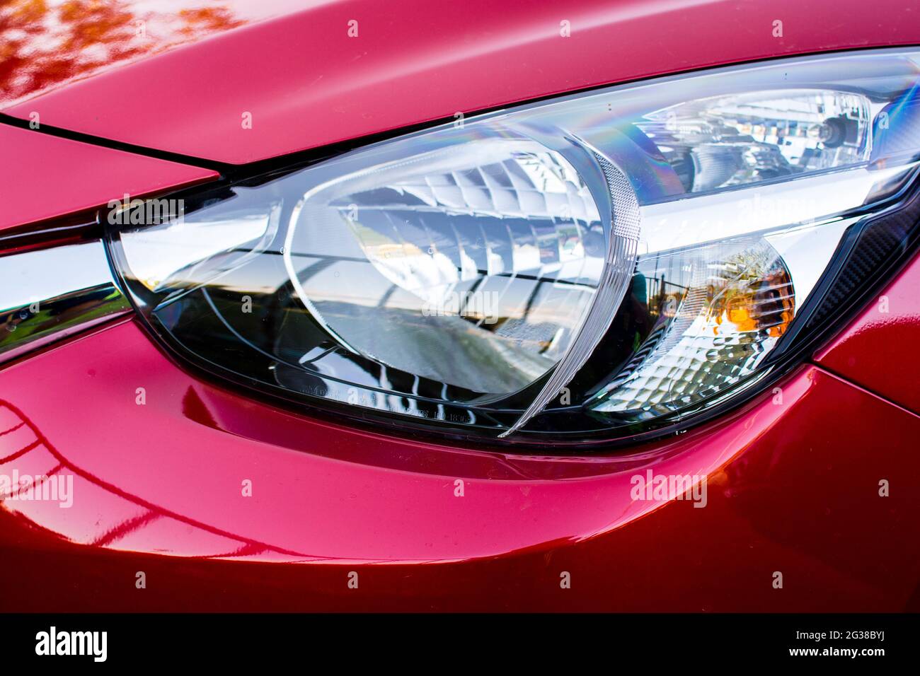 Closeup headlights of red car Stock Photo - Alamy