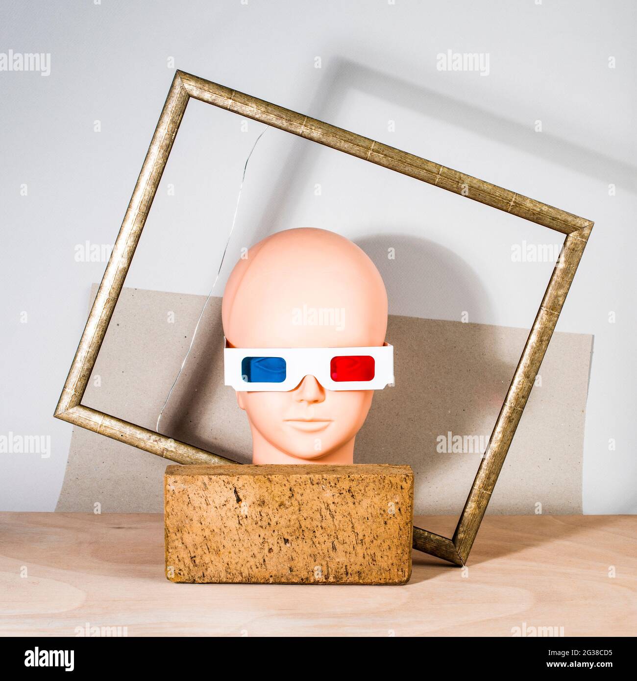Abstract composition of brick, wooden frame, mannequin's head and 3D ...