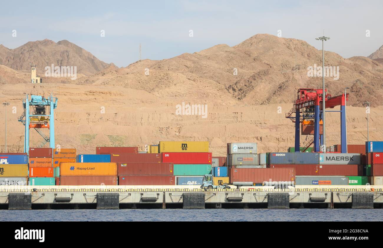 Loading a large ship with transport containers in Aqaba, Jordan on the ...