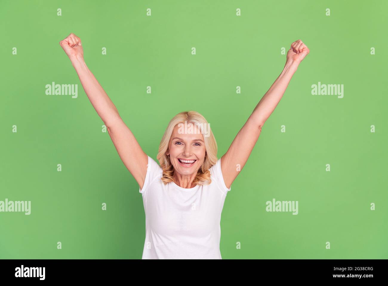 Photo portrait senior woman overjoyed happy gesturing like winner ...