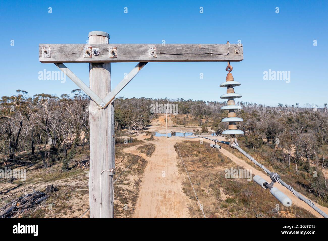 Drone aerial photograph of a telephone pole and wires in a forest ...