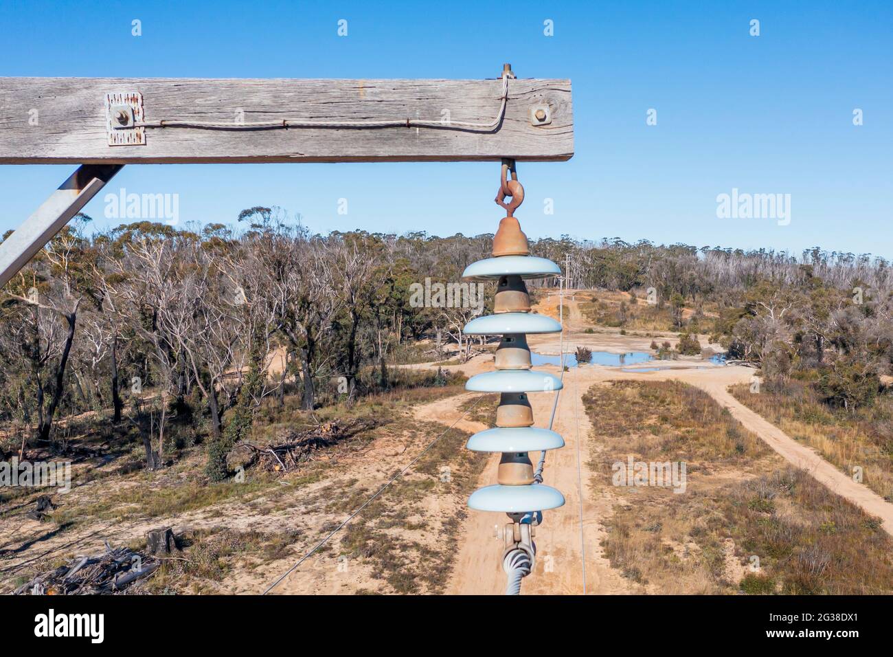 Drone aerial photograph of a telephone pole and wires in a forest ...