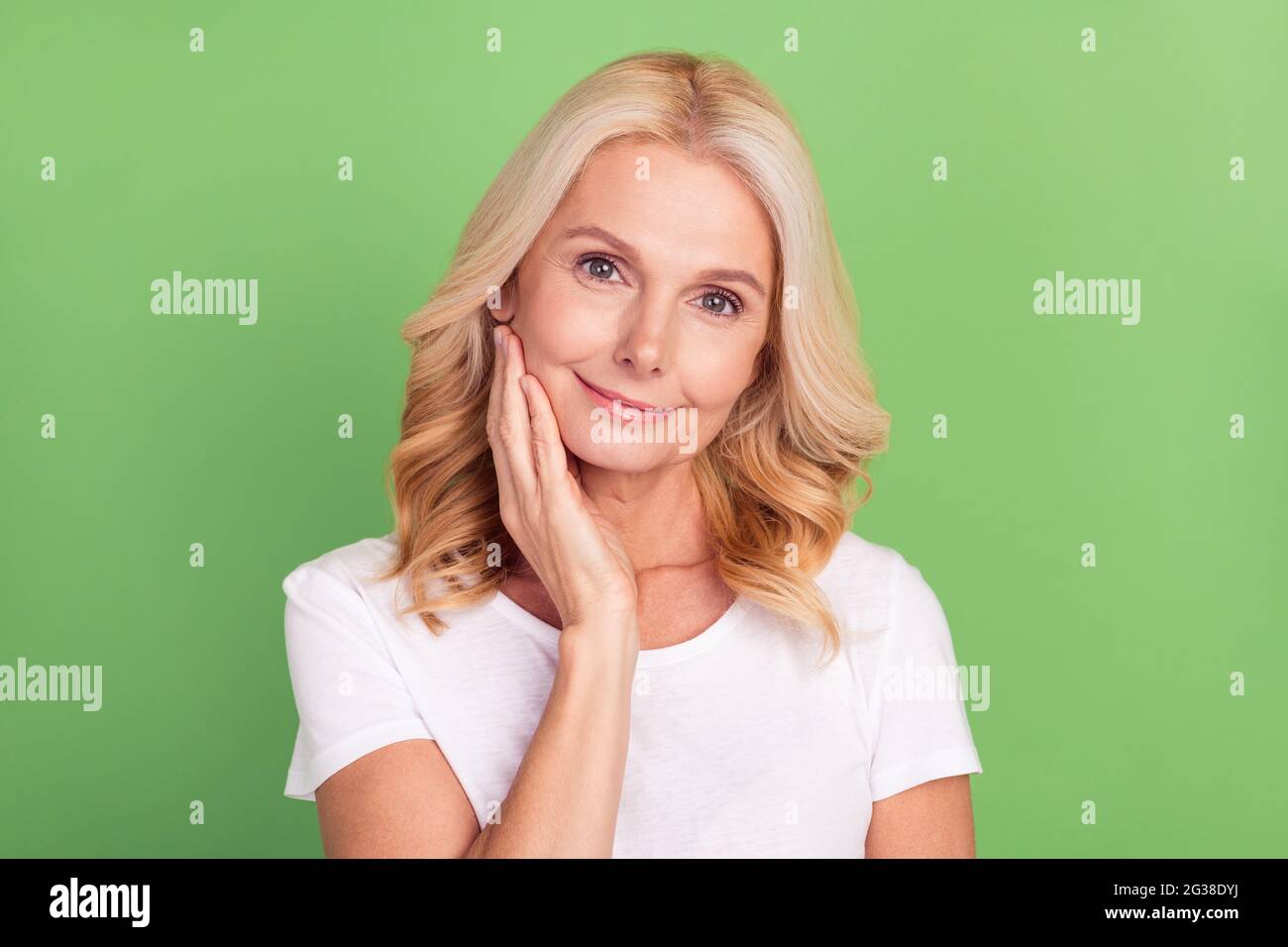 Photo portrait senior woman touching cheek face smiling in casual ...